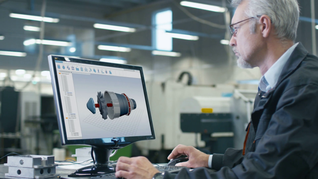 videoblocks-senior-technical-engineer-working-on-cad-program-in-factory ...